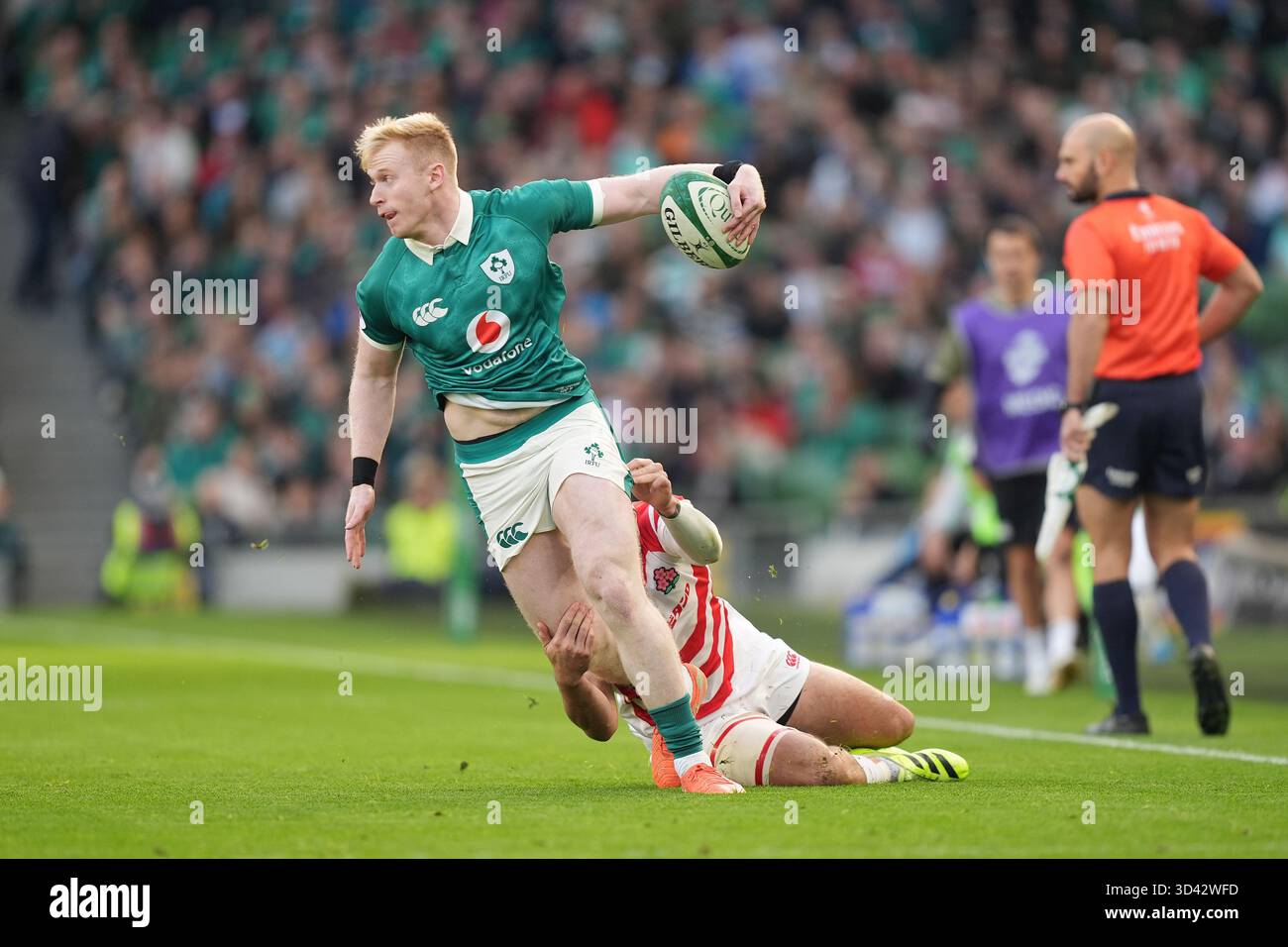 Ireland's Jamie Osborne (left) is tackled by Japan's Dylan Riley during ...