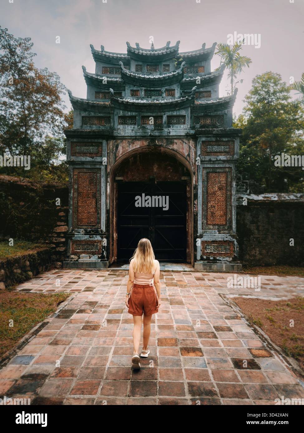 Woman traveling in Vietnam walking in Hue city summer vacations tour ...