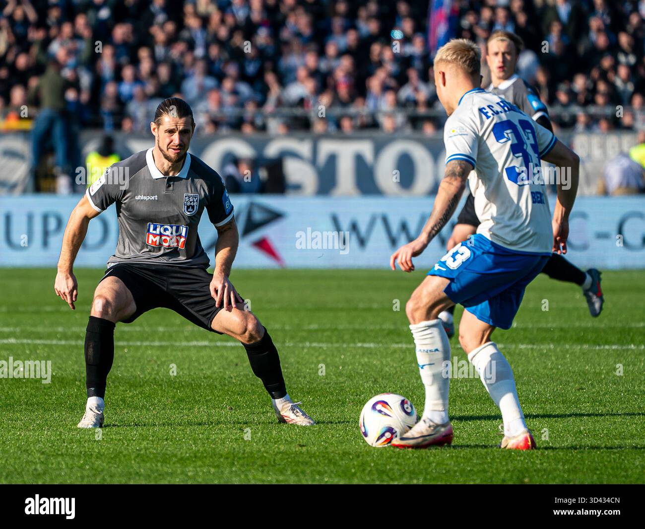 Dennis Chessa (SSV Ulm 1846, #11) in a duel with Viktor Bergh (FC Hansa ...