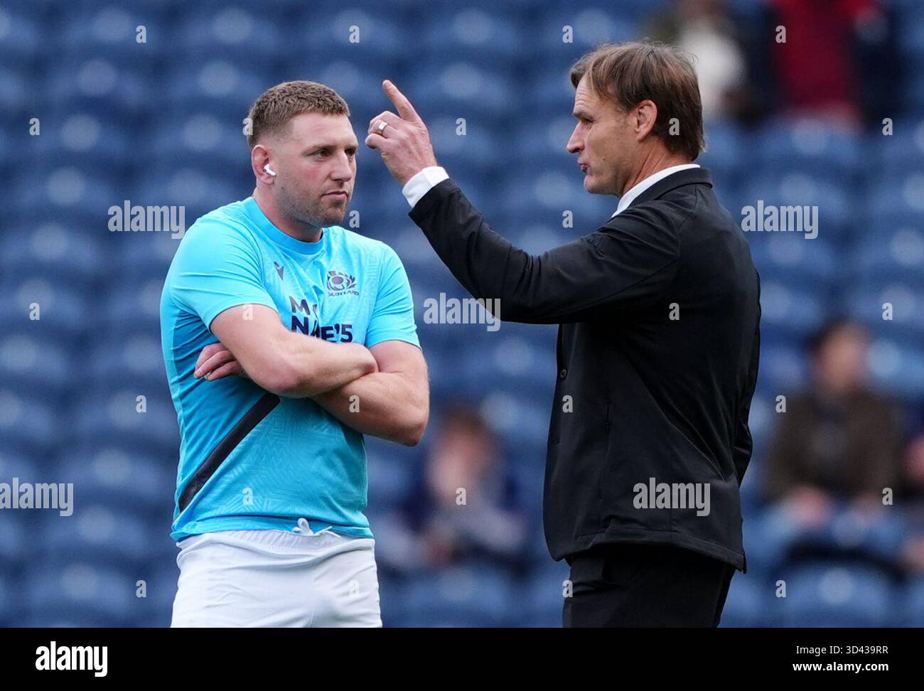 New Zealand head coach Scott Robertson (right) speaks to Scotland's ...