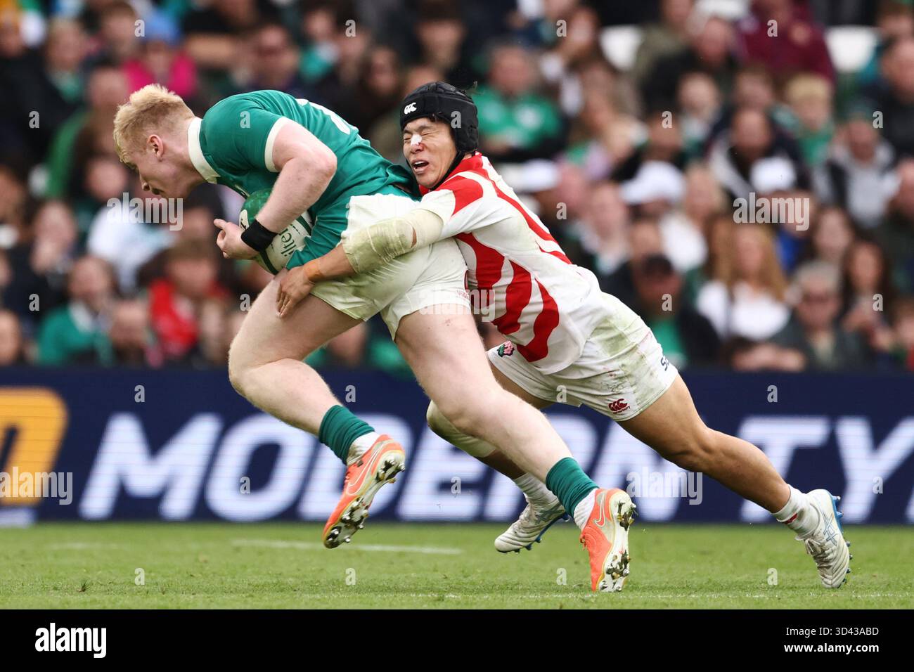 Ireland's Jamie Osborne is tackled by Japan's Kippei Ishida during the ...