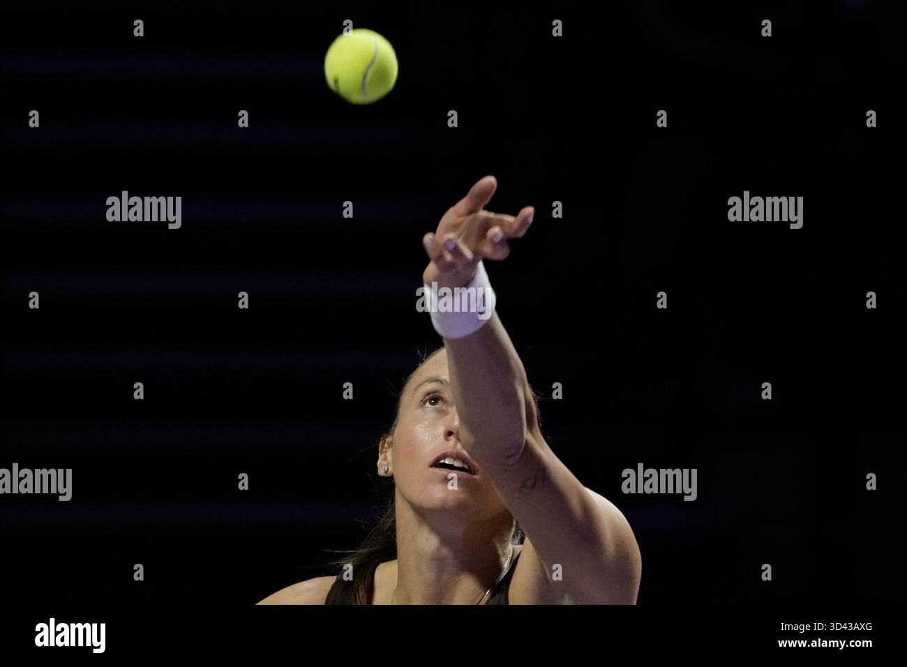 Luisa Stefani of Brazil serves against Elise Mertens of Belgium and ...