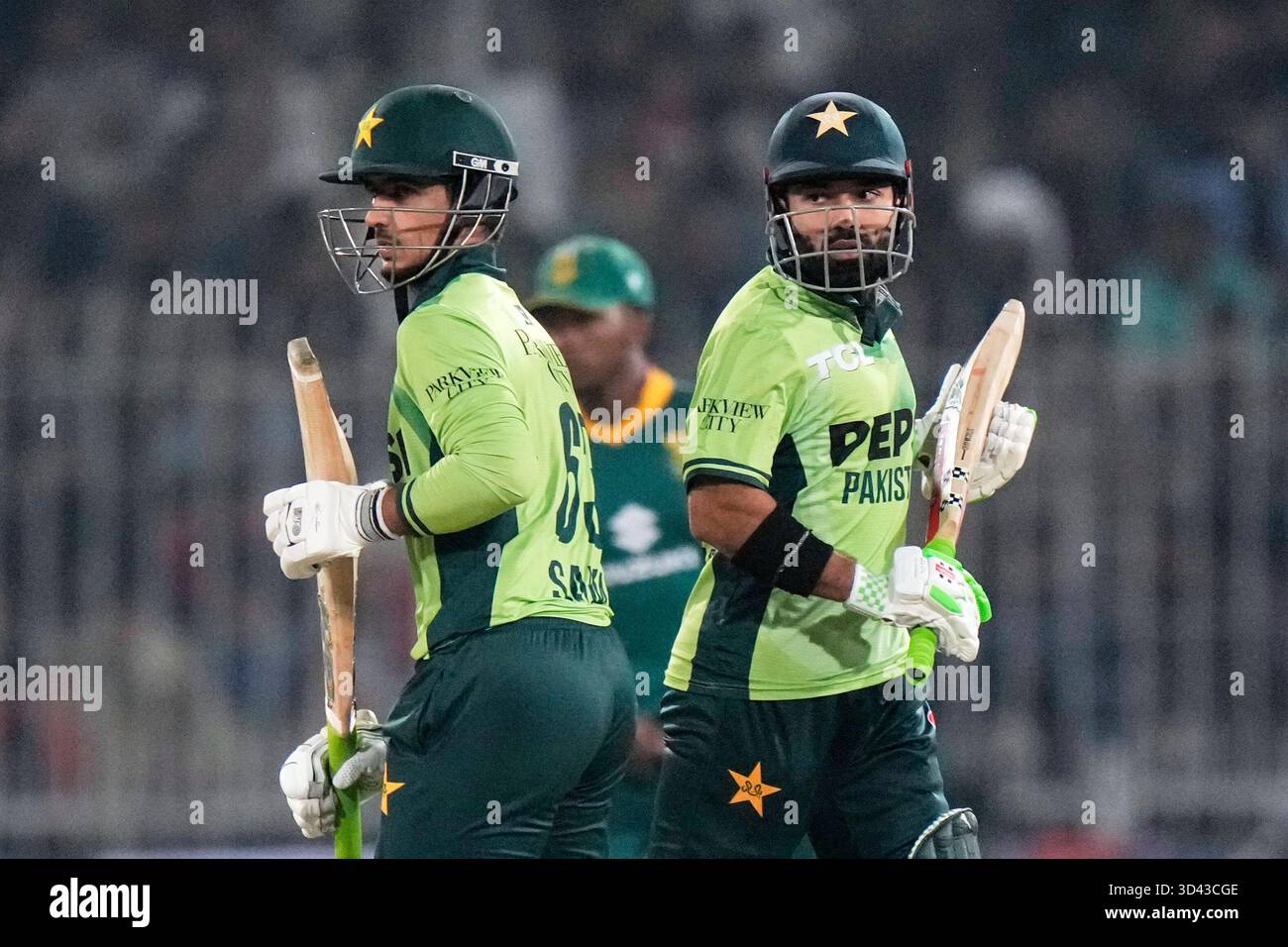Pakistan's Mohammad Rizwan, right, and Saim Ayub run between the ...