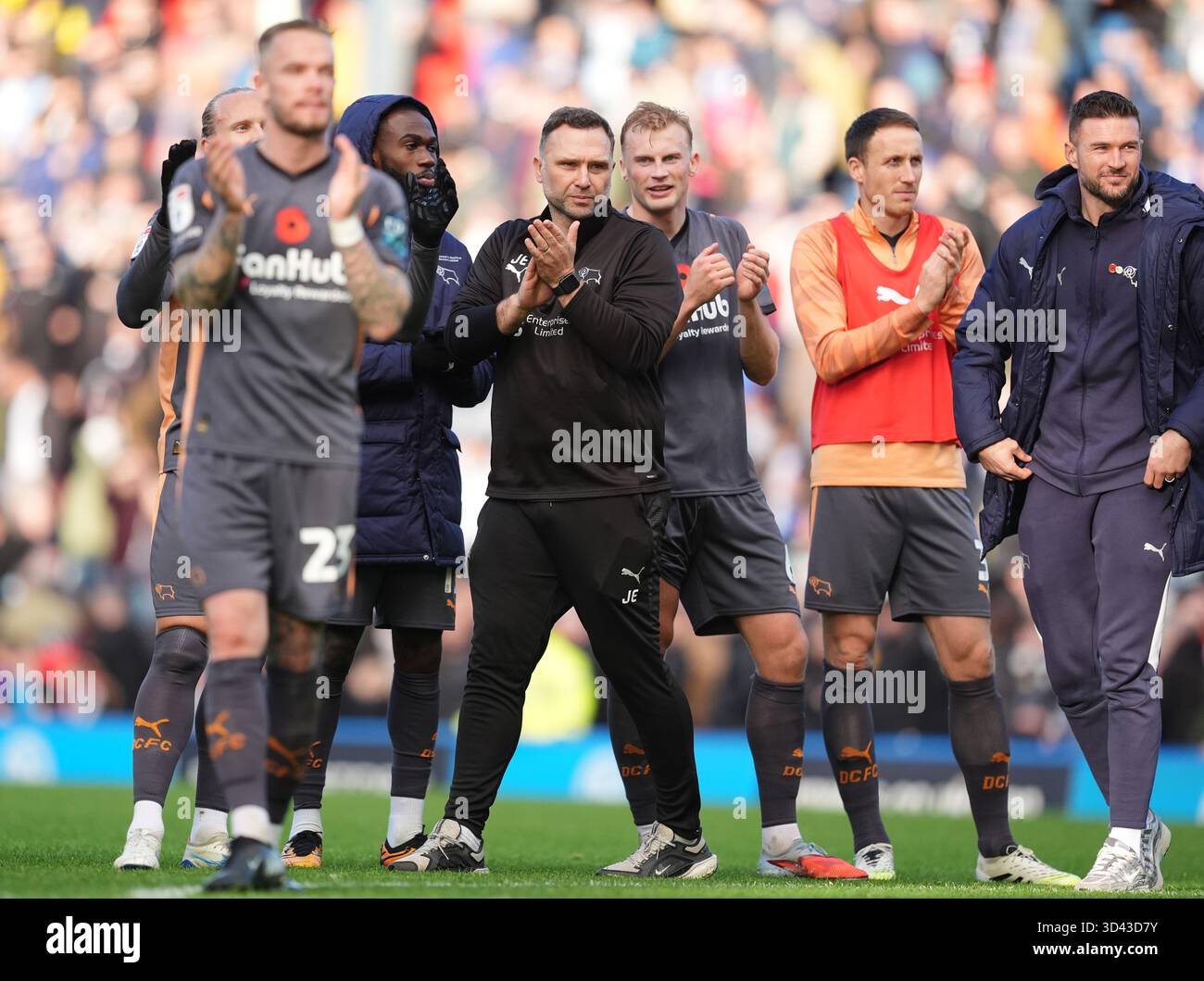 Derby County manager John Eustace (centre) applauds supporters after ...