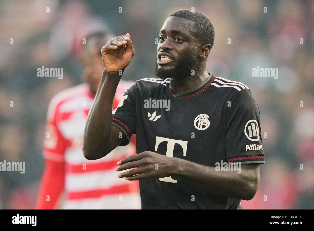 Bayern's Dayot Upamecano gestures during the Bundesliga soccer match ...
