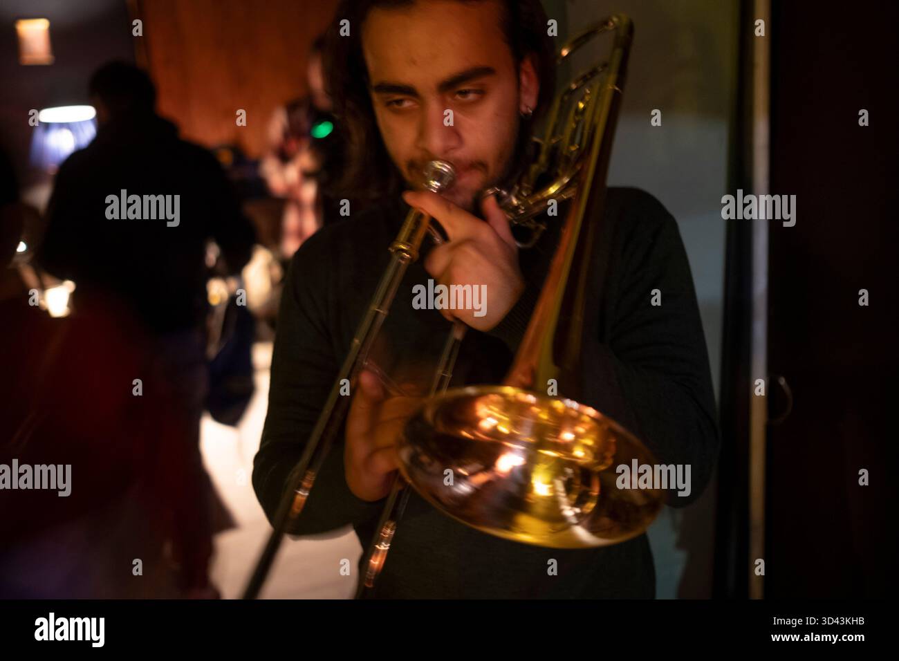 An Iranian musician plays the trumpet while preparing to perform at the ...