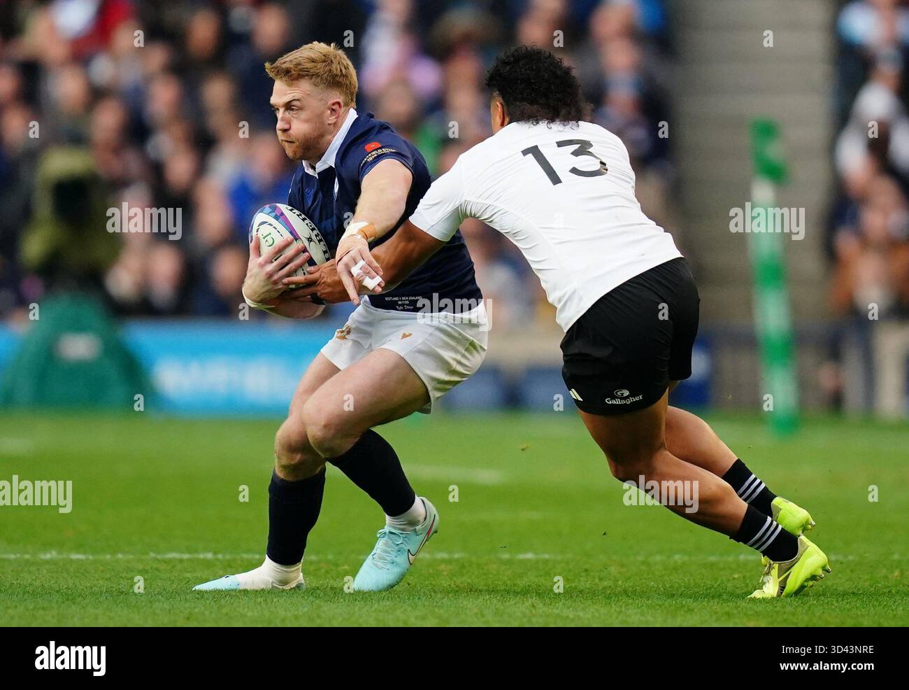 Scotland's Kyle Steyn (left) and New Zealand's Leicester Fainga'anukui ...