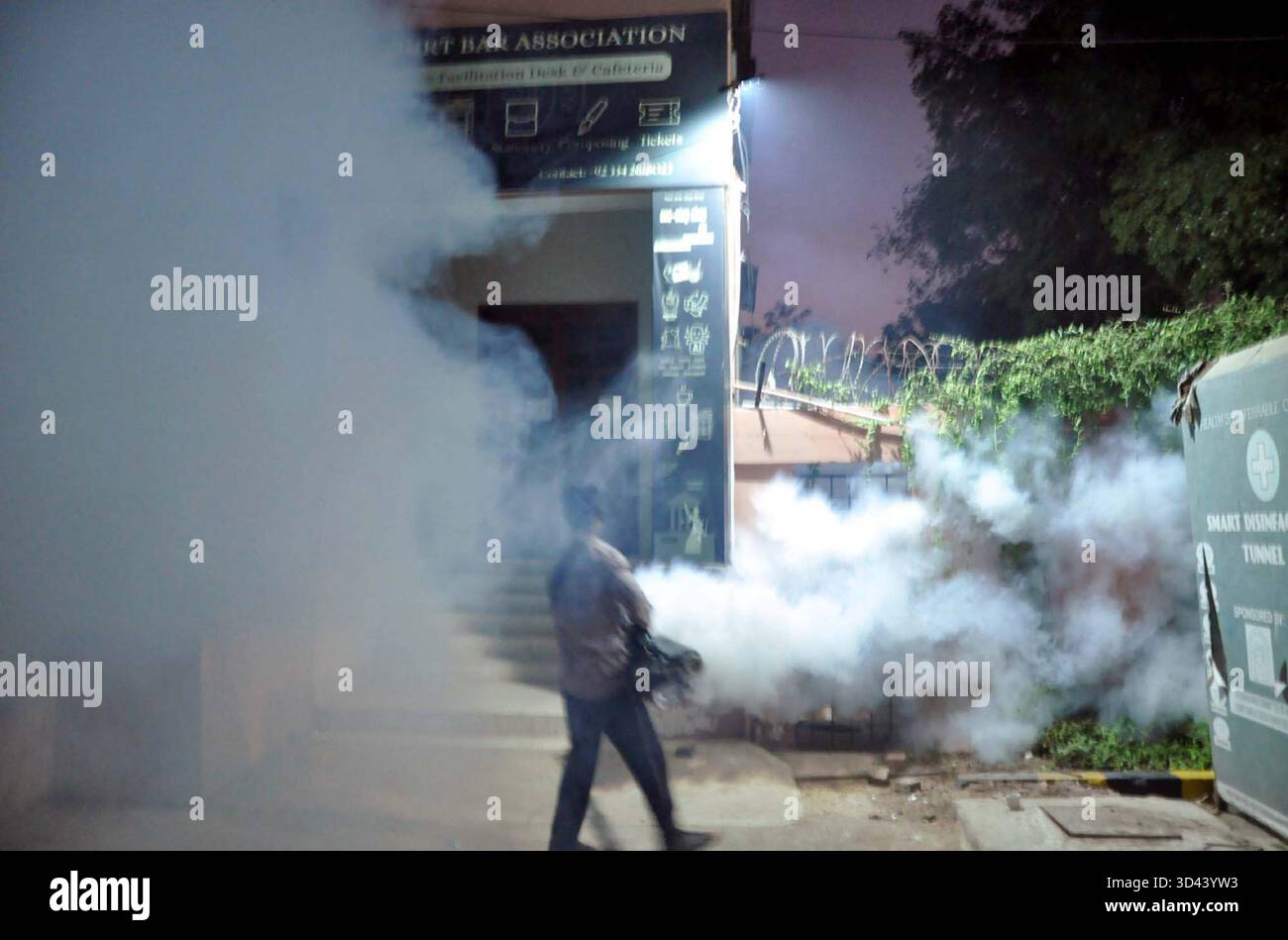 HYDERABAD, PAKISTAN, NOV 08: Health workers spraying anti-dengue fumes ...
