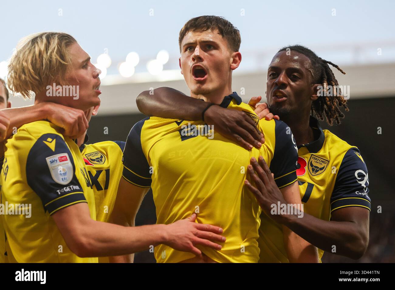 27, Will Lankshear of Oxford United (centre) is congratulated for the ...