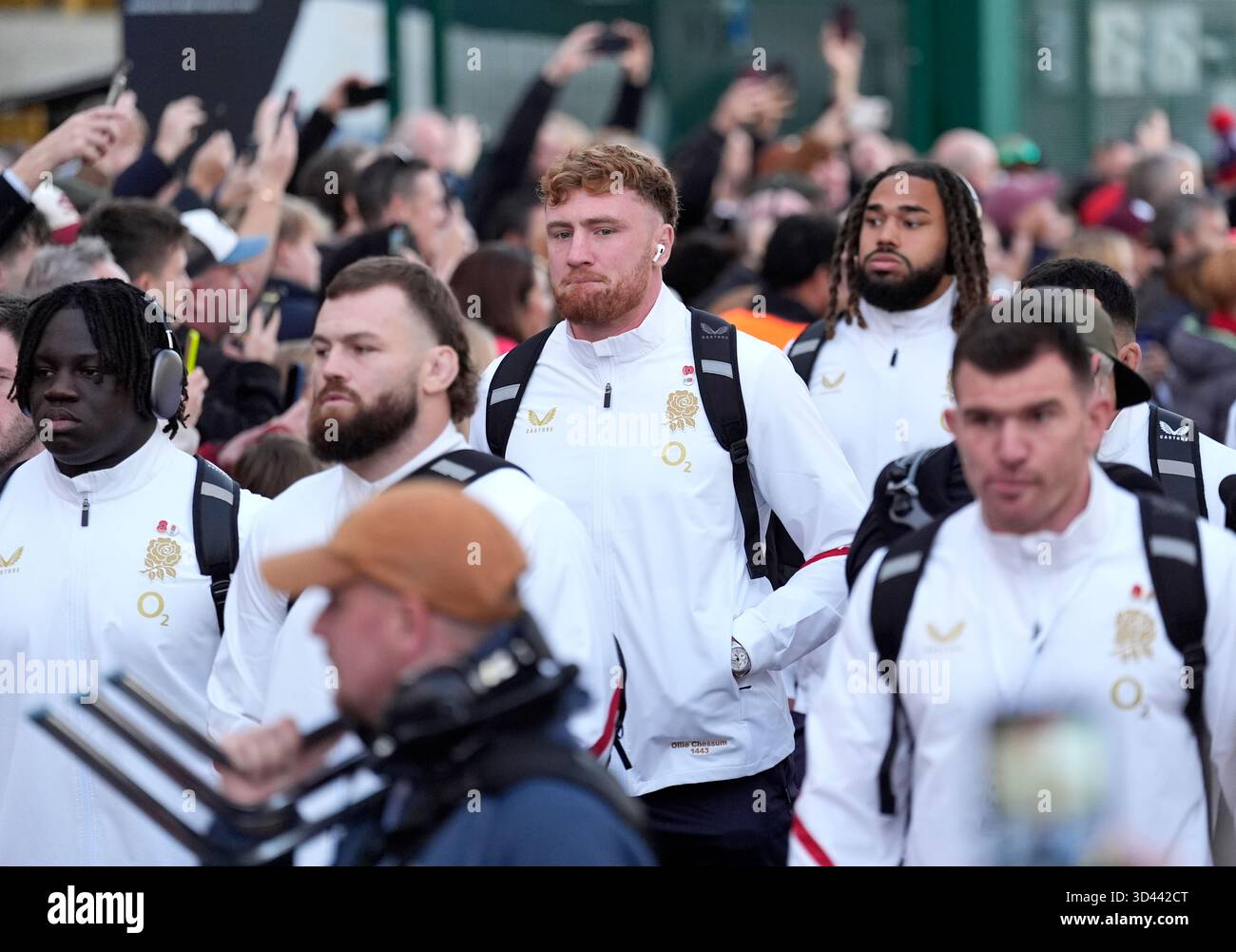 England's Ollie Chessum (centre) arrives with his team mates ahead of ...