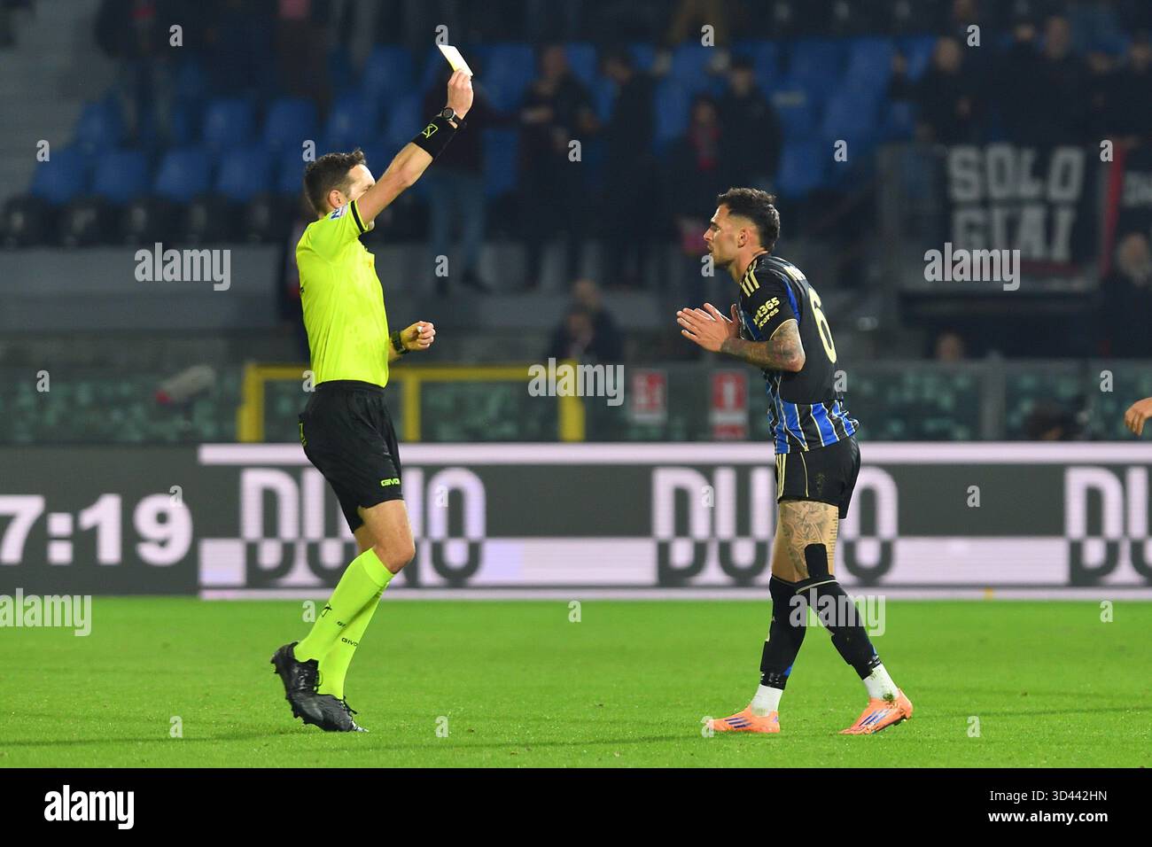 The referee Matteo Marcenaro shows yellow card to Marius Marin (Pisa ...
