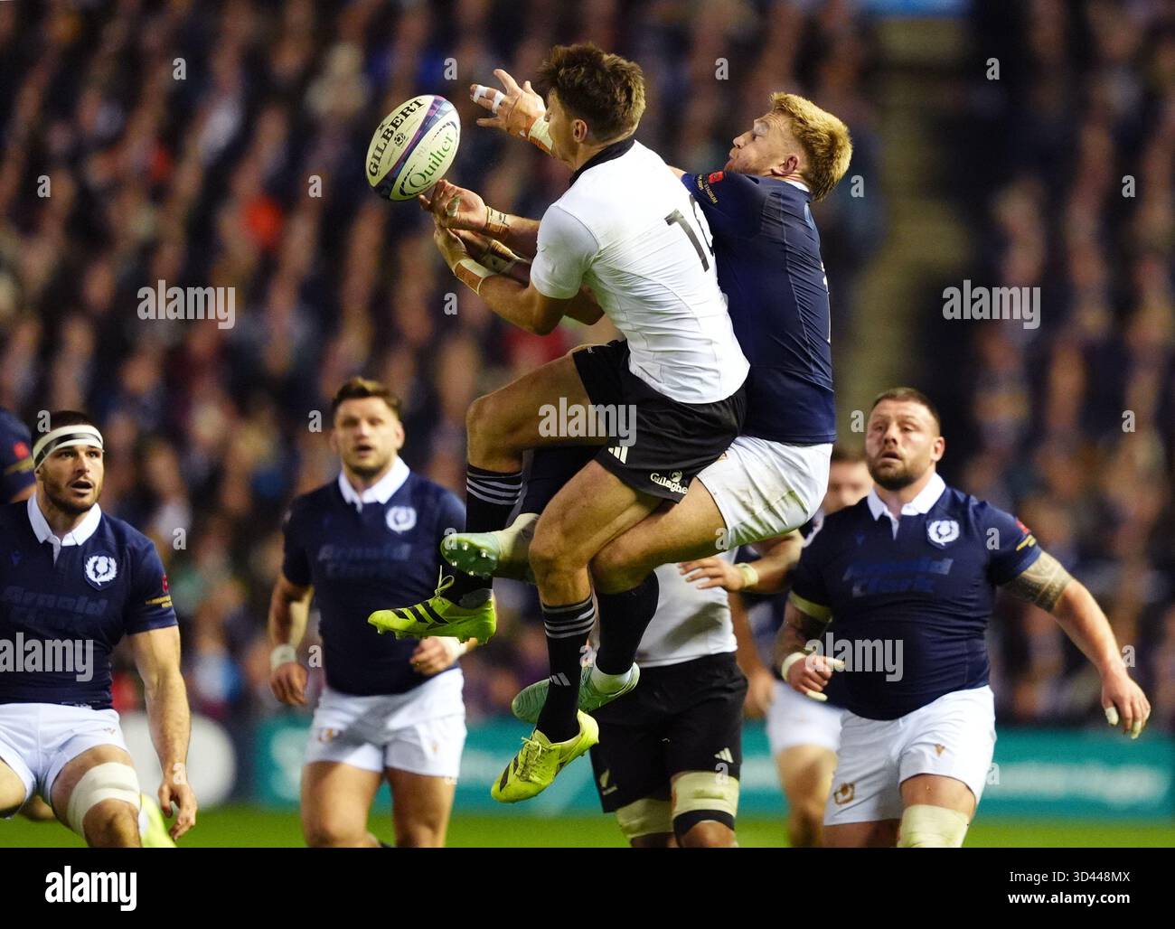 New Zealand's Beauden Barrett (left) and Scotland's Kyle Steyn in ...