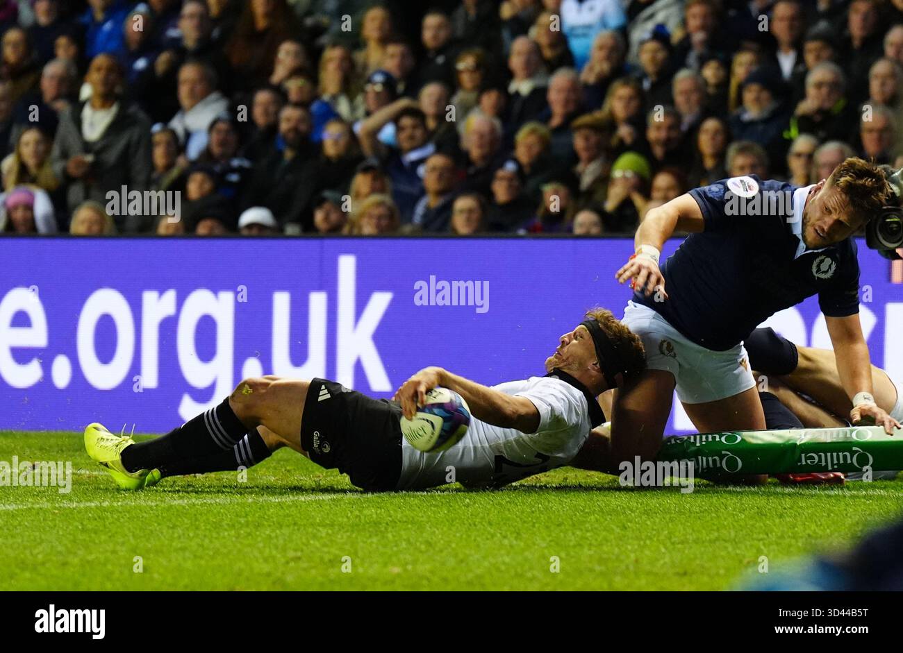 New Zealand's Damian McKenzie scores their side's third try during the ...