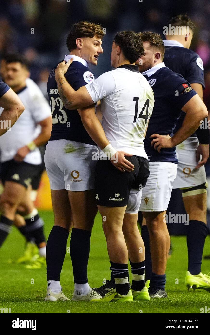 Scotland's Tom Jordan (left) speaks with New Zealand's Leroy Carter ...