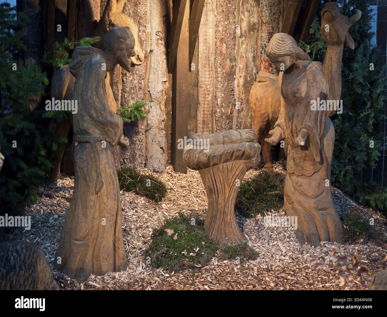 Wooden crib figures in a warm atmosphere, depicting a scene from the ...