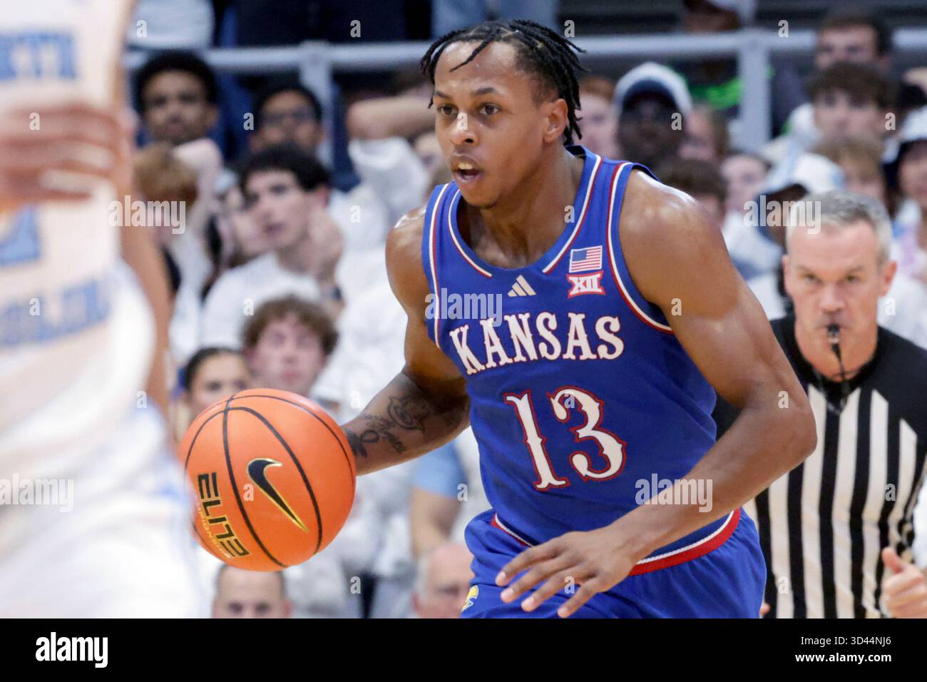 Kansas guard Elmarko Jackson (13) brings the ball up the floor against ...