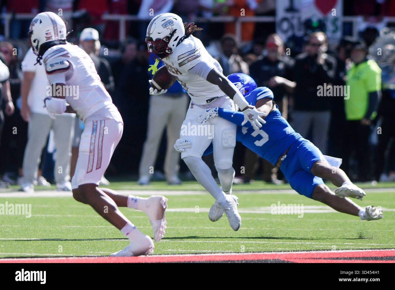 Texas Tech tight end Terrance Carter Jr. (7) is tackled by BYU safety ...