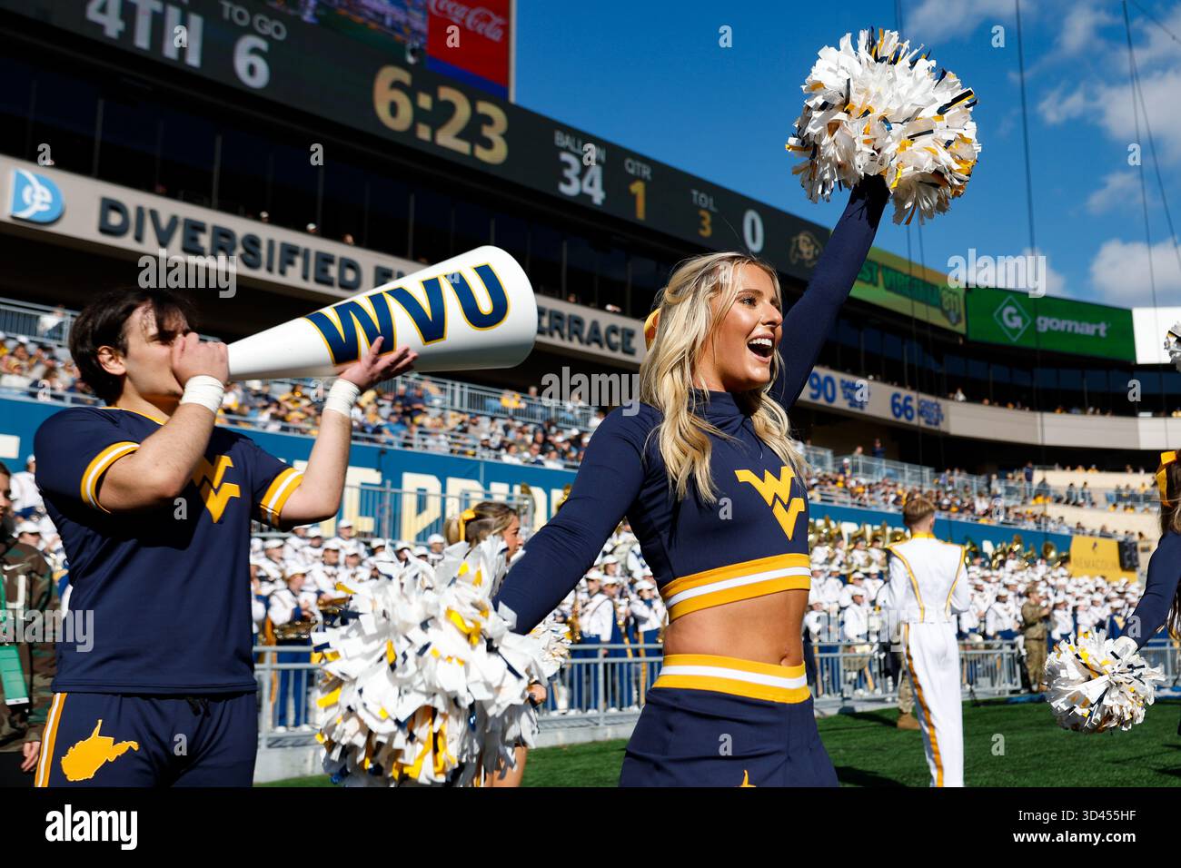 November 8, 2025: A West Virginia Mountaineers cheerleader leads a ...