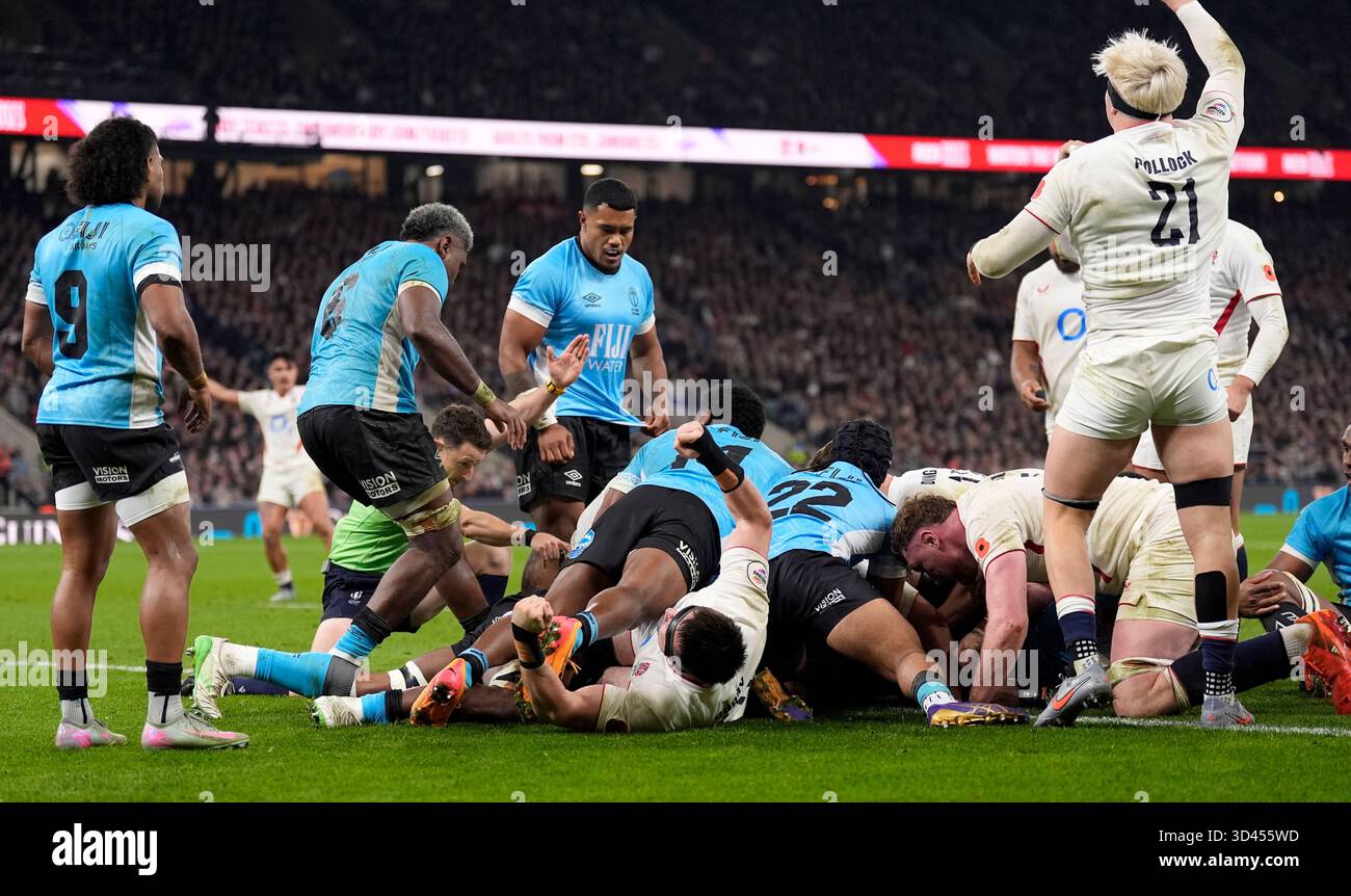 England's Jamie George (obscured) scores a try during the Quilter ...