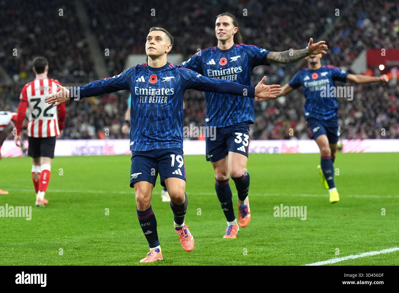 Arsenal's Leandro Trossard (second left) celebrates scoring their side ...
