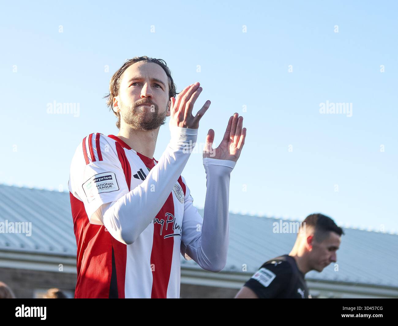BRACKLEY, ENGLAND - NOVEMBER 8: Morgan Roberts of Brackley Town walks ...