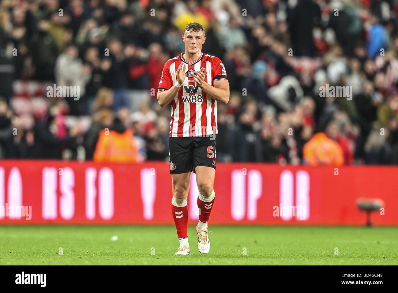 Daniel Ballard of Sunderland applauds the fans after the game during ...