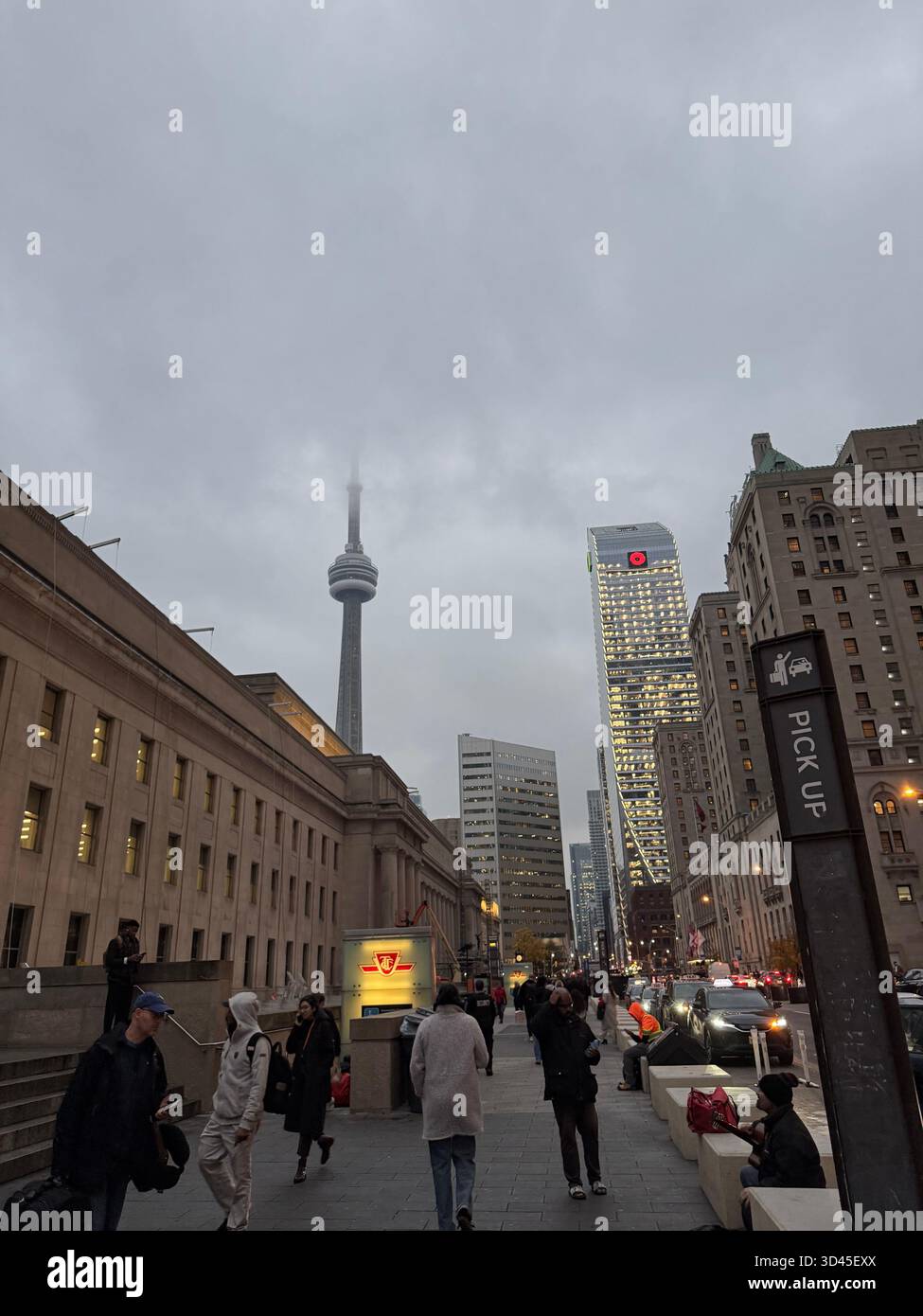 Toronto downtown street view with CN Tower at dusk,A typical urban atmosphere showing the city’s ...