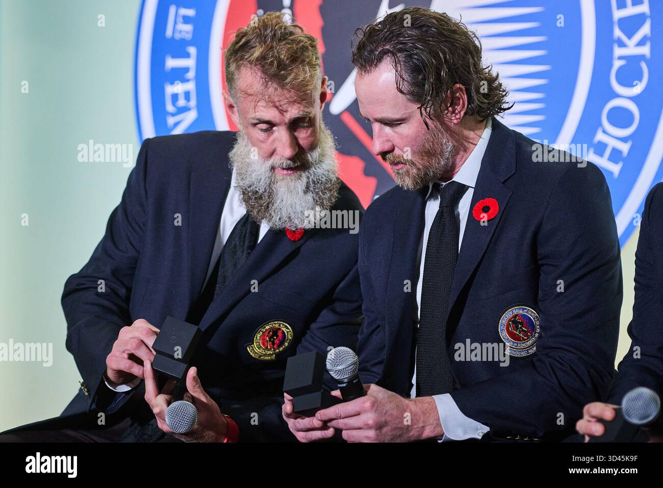Hockey Hall of Fame inductees Joe Thornton, left, and Duncan Keith look at their rings in ...