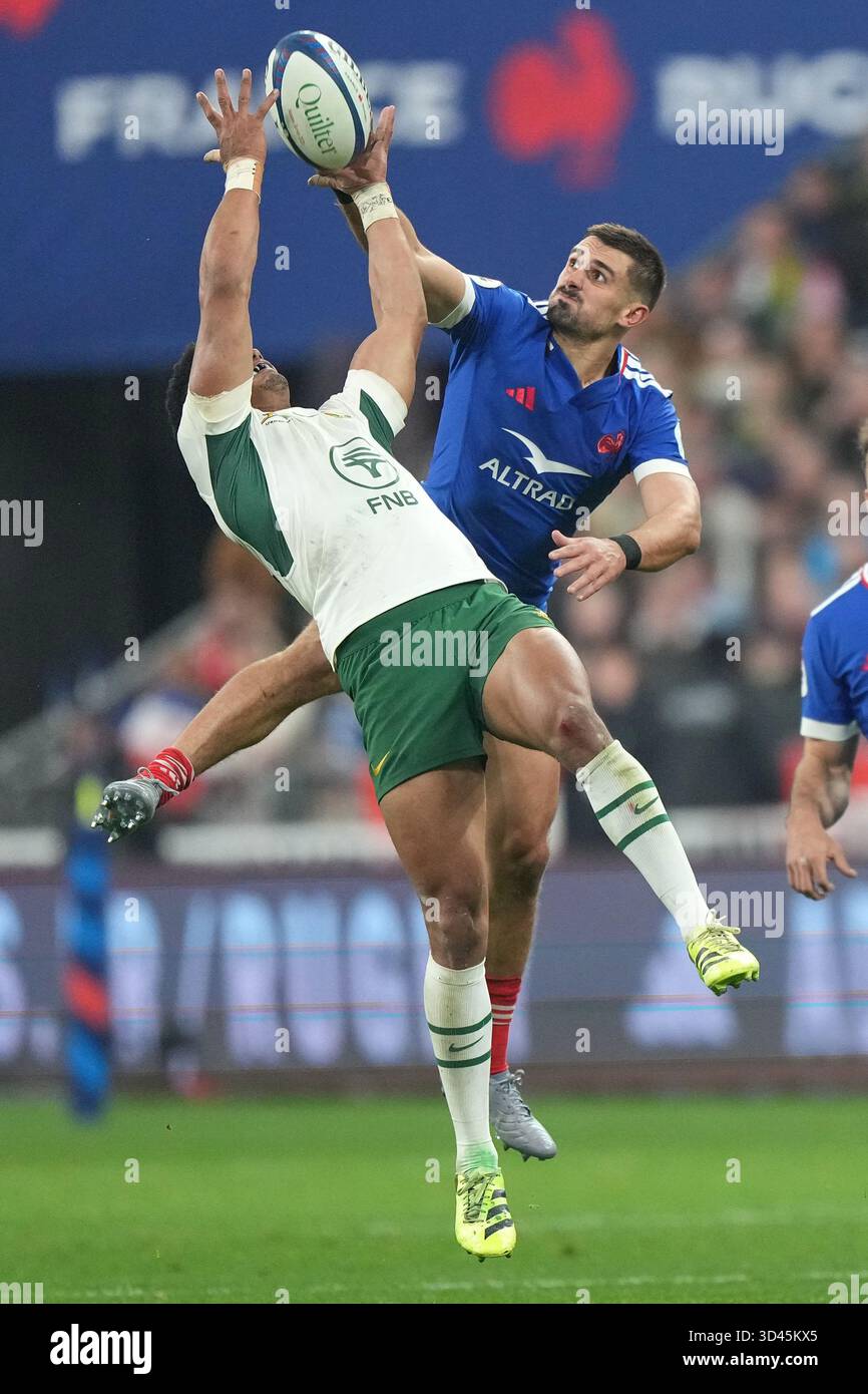 South Africa's Sacha Feinberg-Mngomezulu, left, challenges France's ...