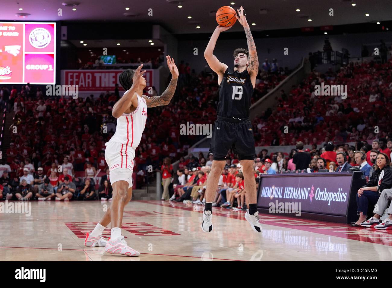 Towson guard Tyler Tejada (15) shoots against Houston center Chris ...