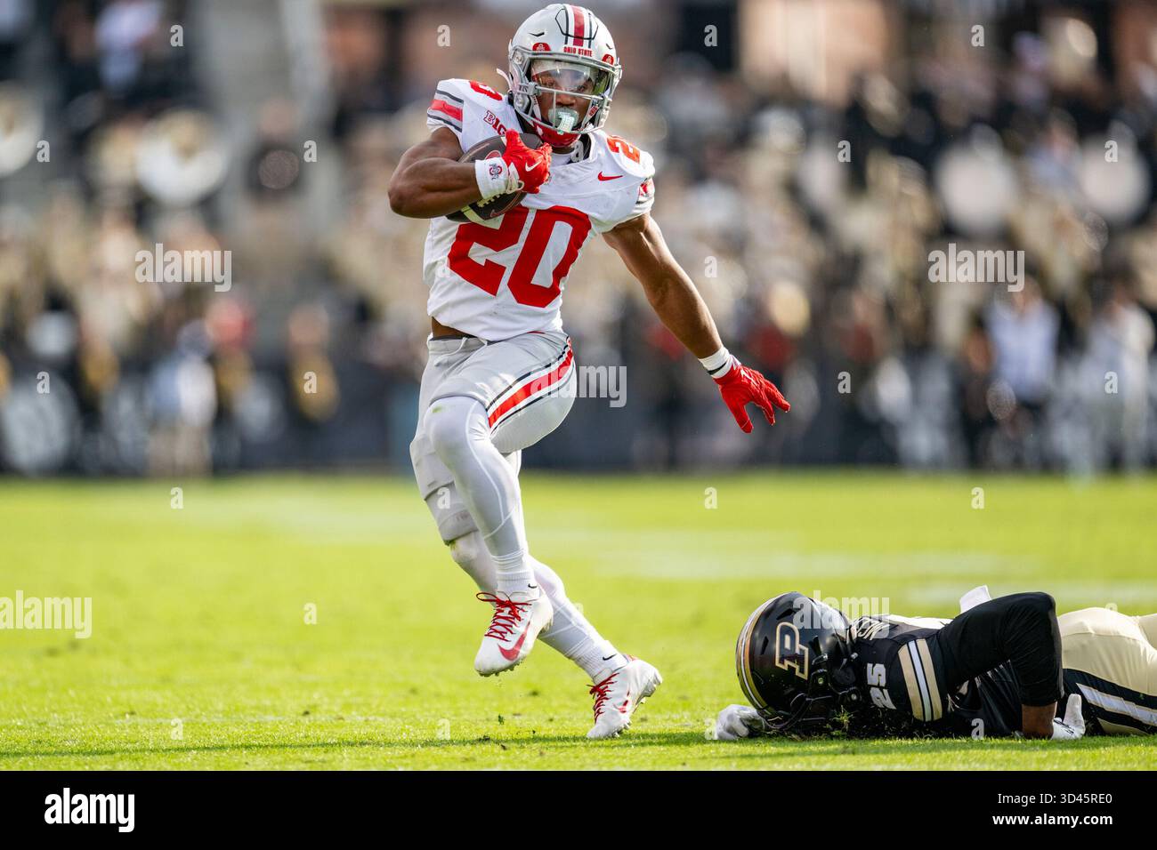 Ohio State running back James Peoples (20) runs away from a tackle ...