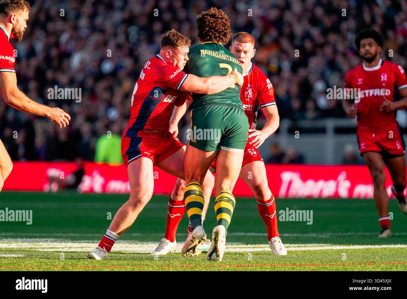 LEEDS, ENGLAND - November 8:Mark Nawaqanitawase of Australia is tackled by Morgan Smithies & Joe ...
