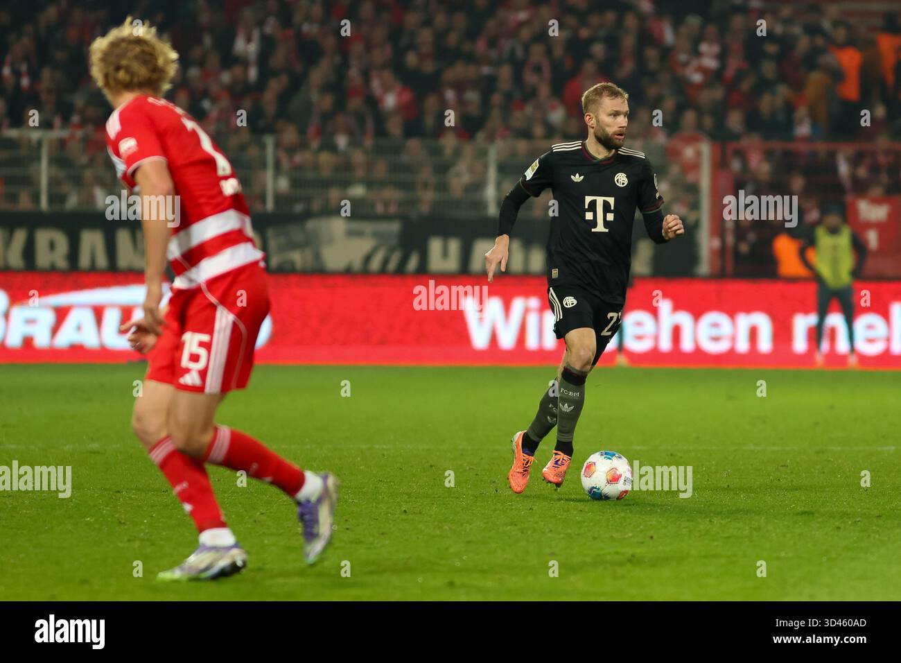 Konrad Laimer (FC FC Bayern Munich, #27) with ball, with Tom Rothe ...