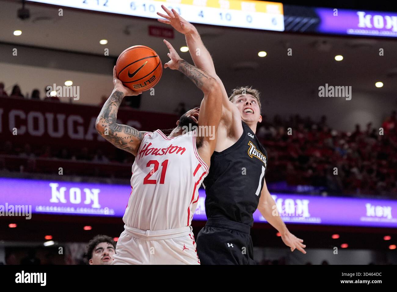 Towson guard Tyler Schmidt (1) fouls Houston guard Emanuel Sharp (21 ...