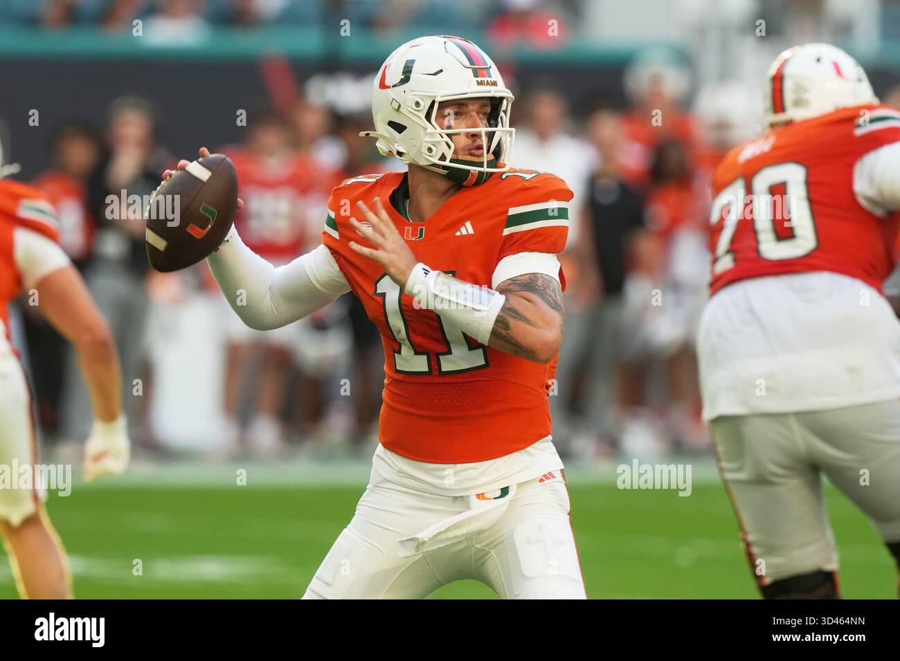 Miami quarterback Carson Beck (11) aims a pass during the first half of ...