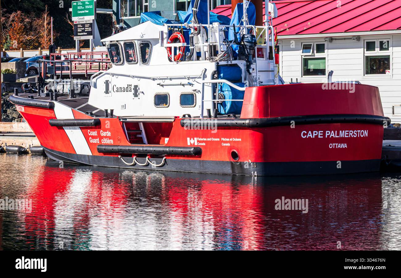 Red and white Canadian Coast Guard ship at dock on Vancouver Island ...