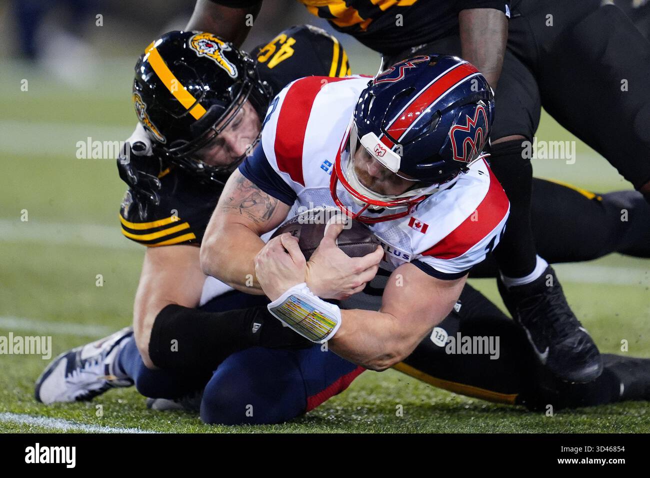 Montreal Alouettes quarterback Davis Alexander (10) gets sacked by ...