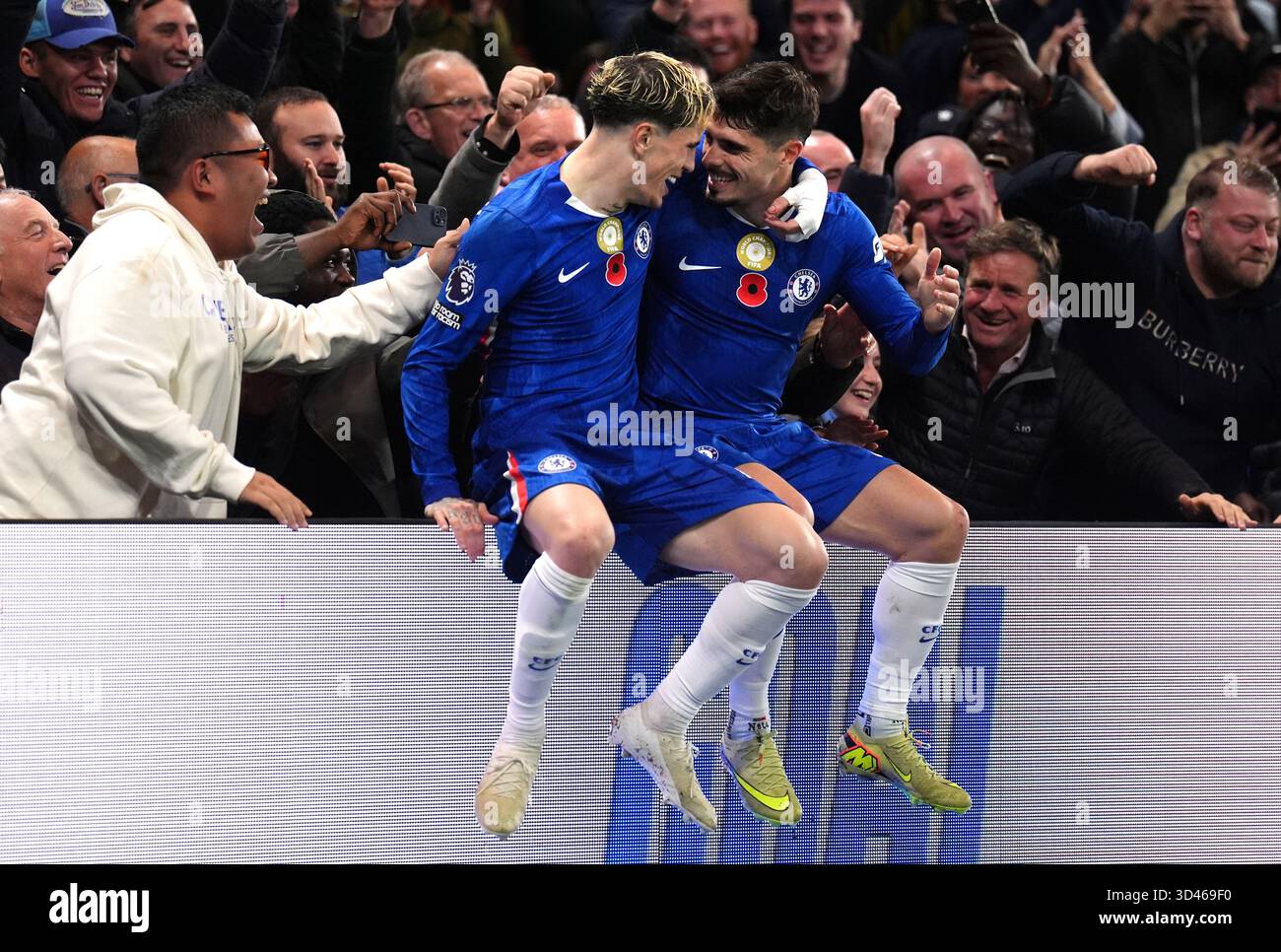 Chelsea's Pedro Neto (right) celebrates scoring their side's third goal ...