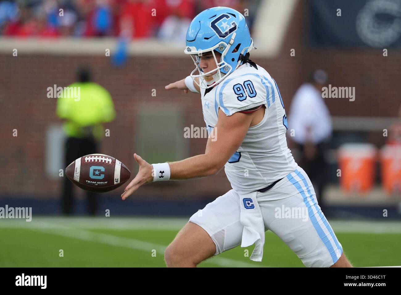 Citadel punter James Platte (90) attempts to punt away during the ...