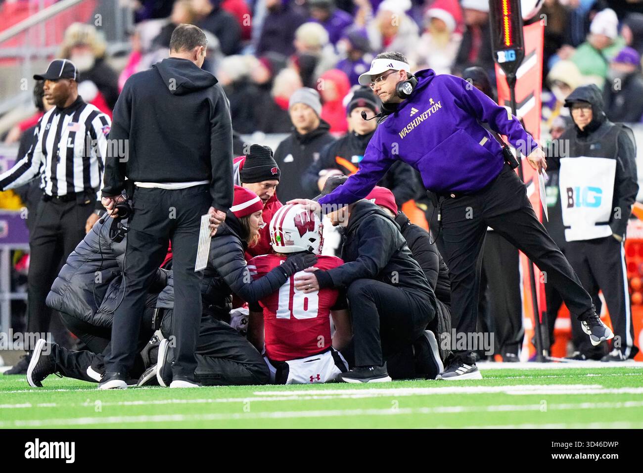 Washington head coach Jedd Fisch consoles Wisconsin's Danny O'Neil ...