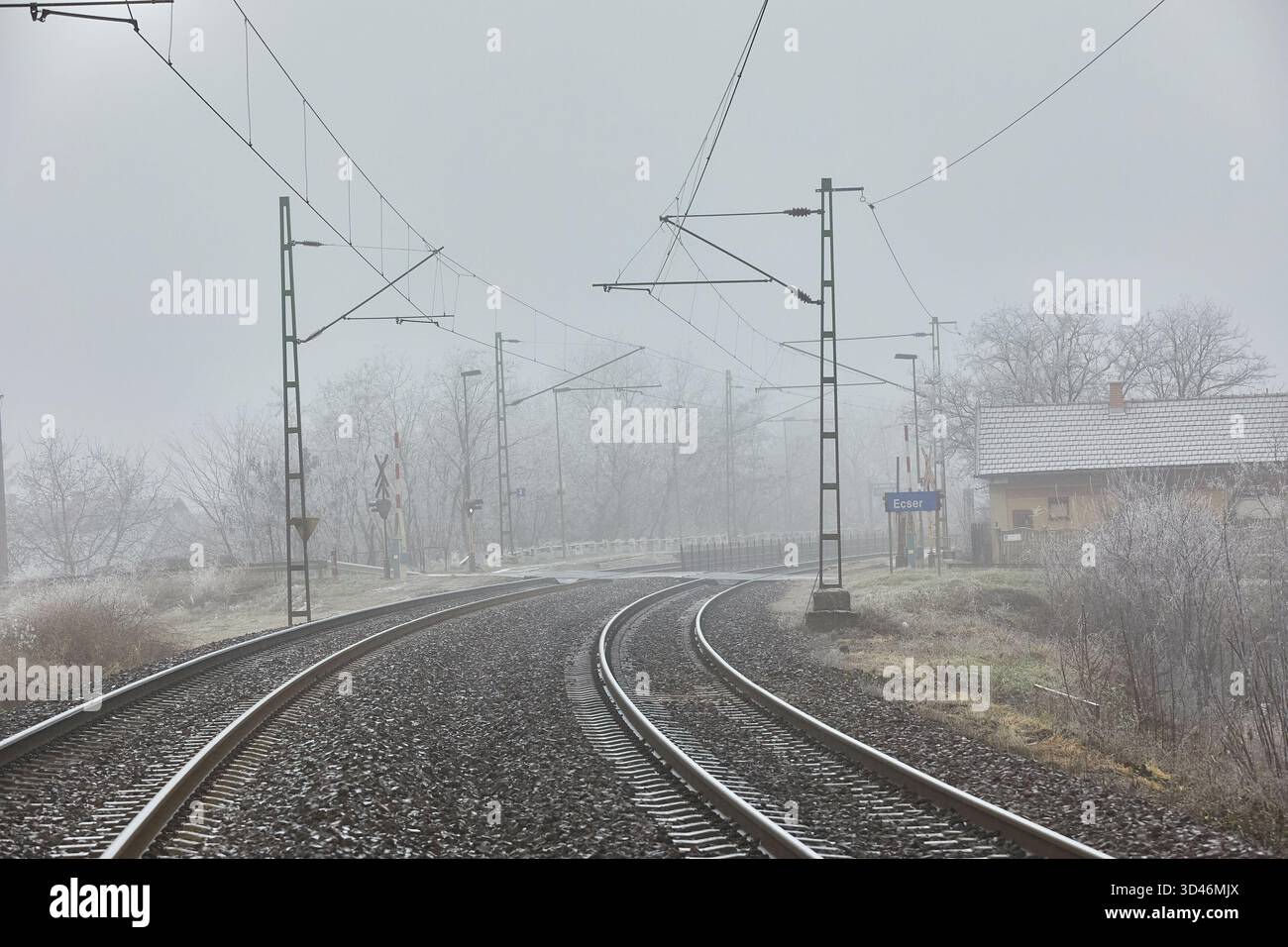 Double track railway main line rails in winter frost snow and fog Stock ...