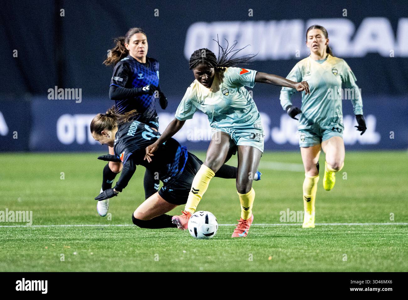 Vancouver Rise's Bridget Mutipula (centre) fights off Ottawa Rapid's ...