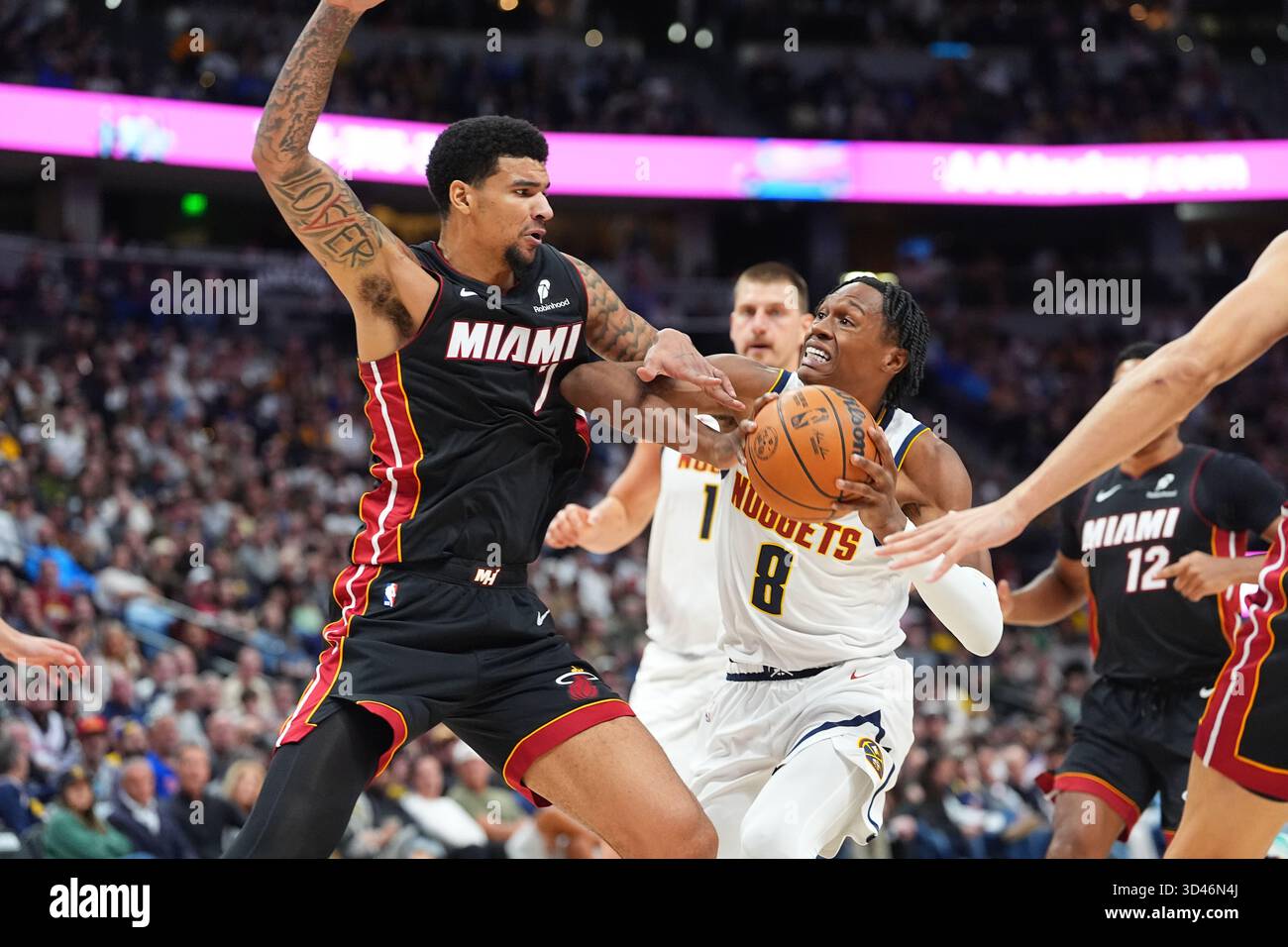Denver Nuggets guard Peyton Watson (8) and Miami Heat center Kel'el ...