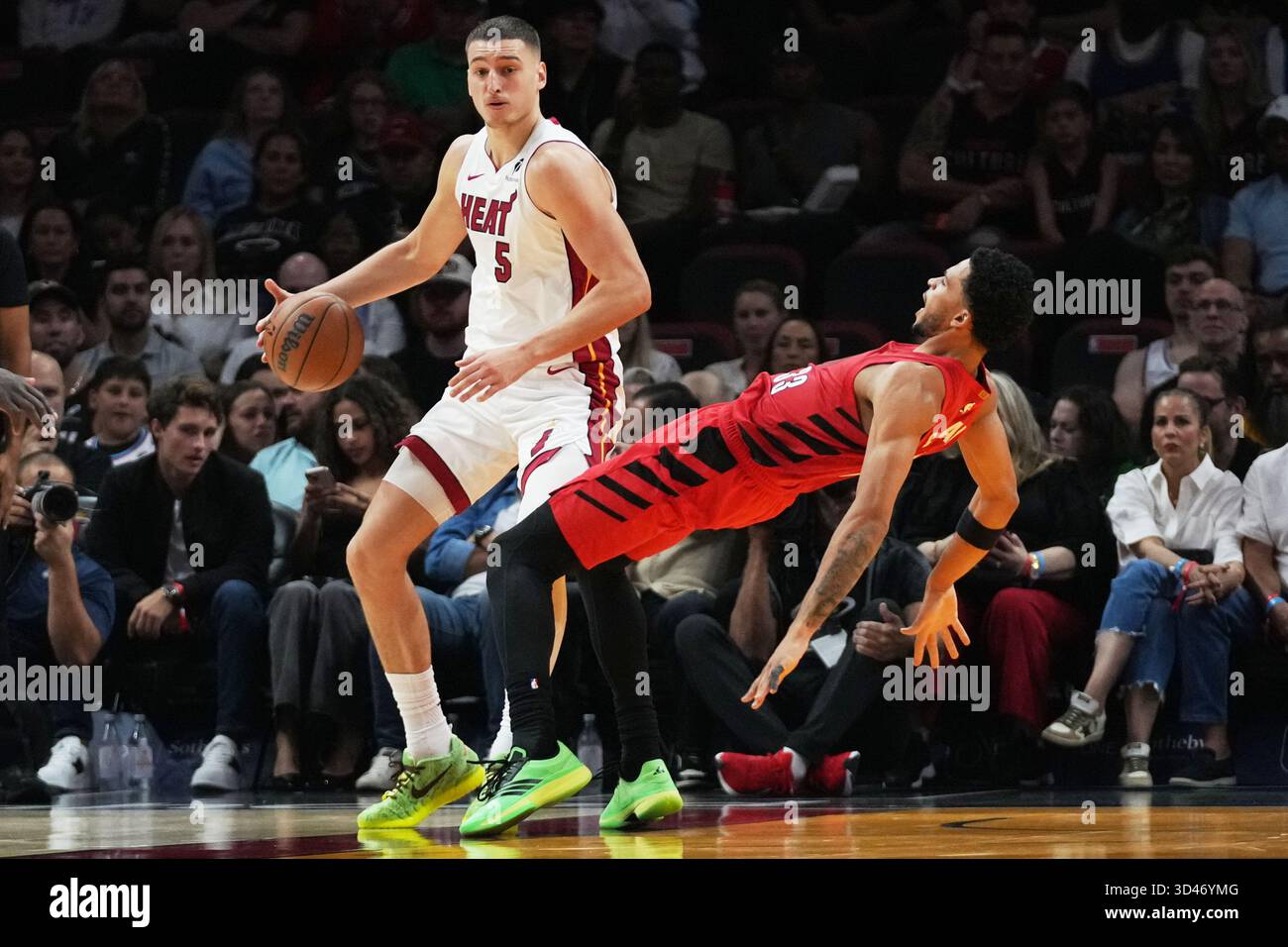 Portland Trail Blazers forward Toumani Camara, right, is fouled by ...