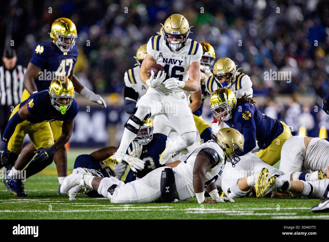 November 08, 2025: Navy running back Alex Tecza (46) leaps the pile ...