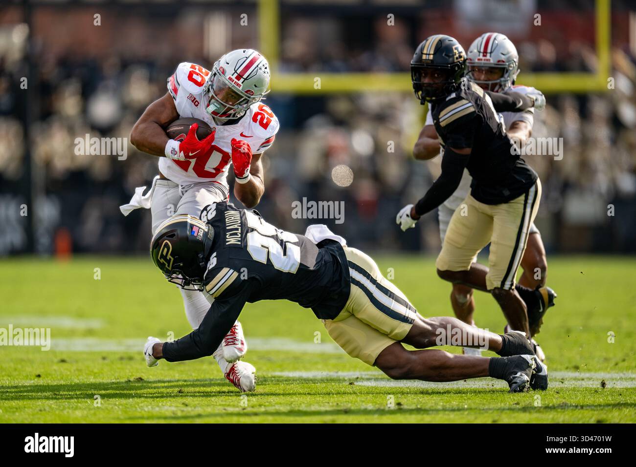 Ohio State running back James Peoples (20) is hit by Purdue defensive ...