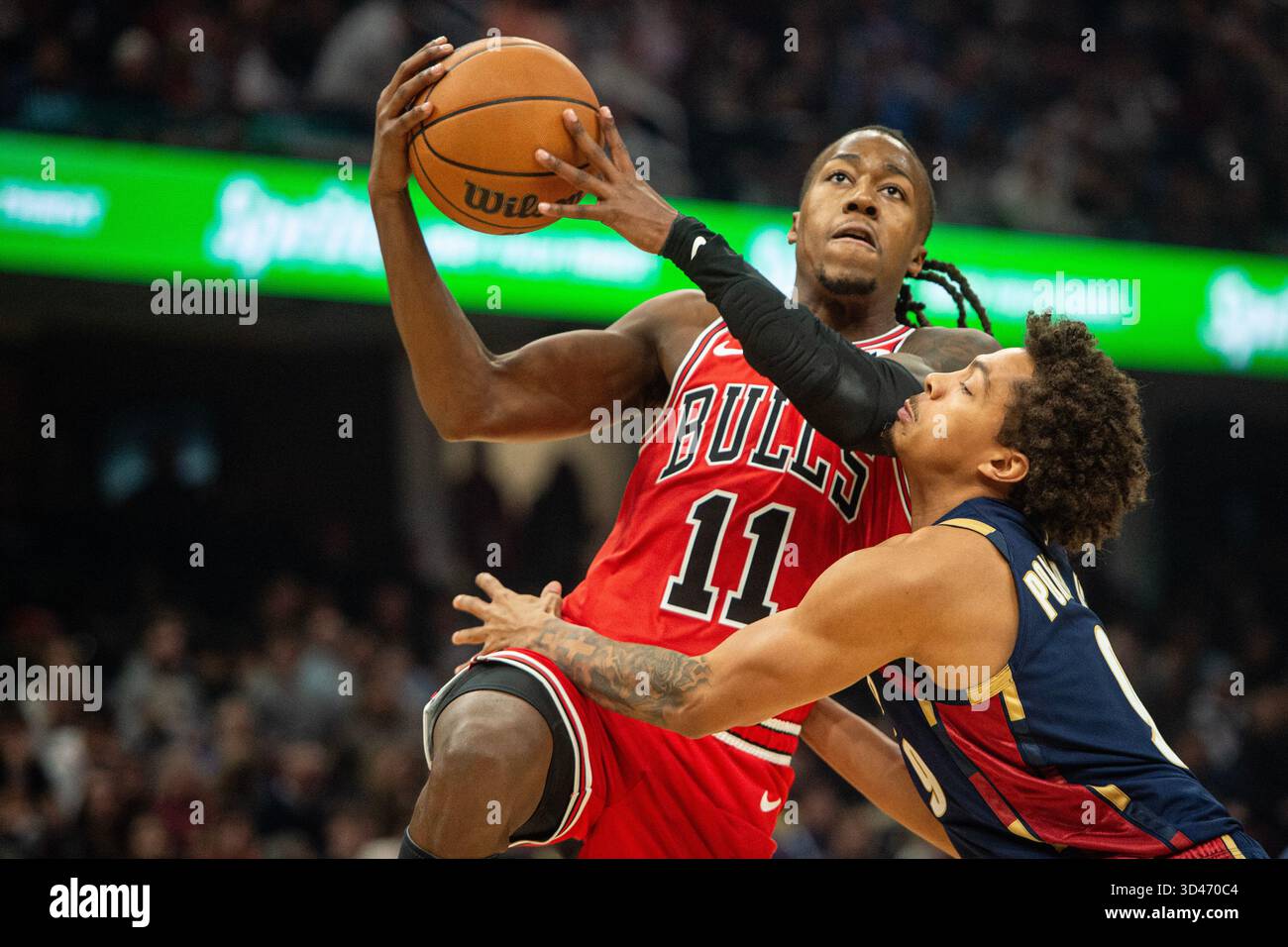 Chicago Bulls' Ayo Dosunmu (11) drives as Cleveland Cavaliers' Craig ...