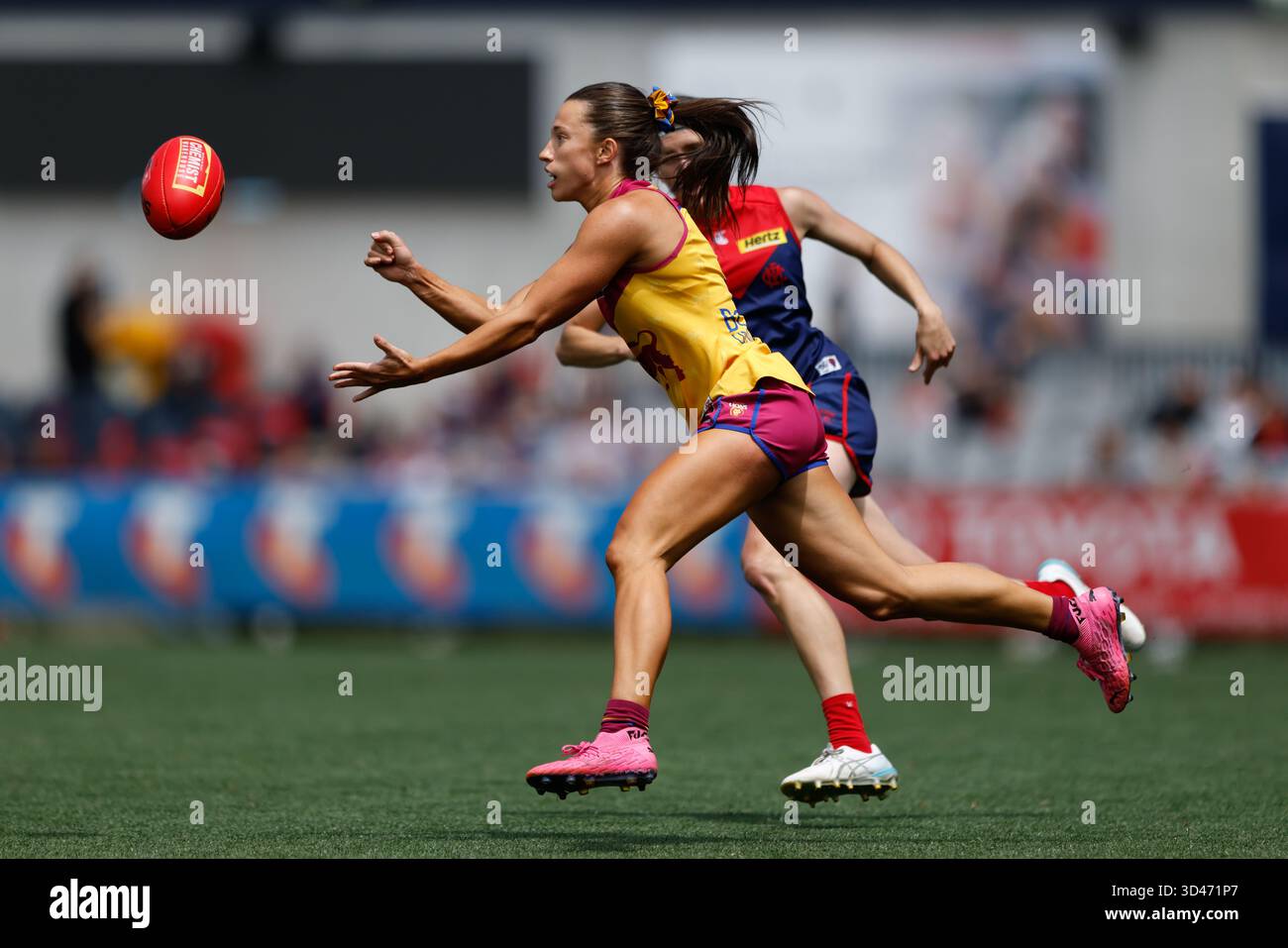 Jade Ellenger of the Lions handpasses the ball during the AFLW ...
