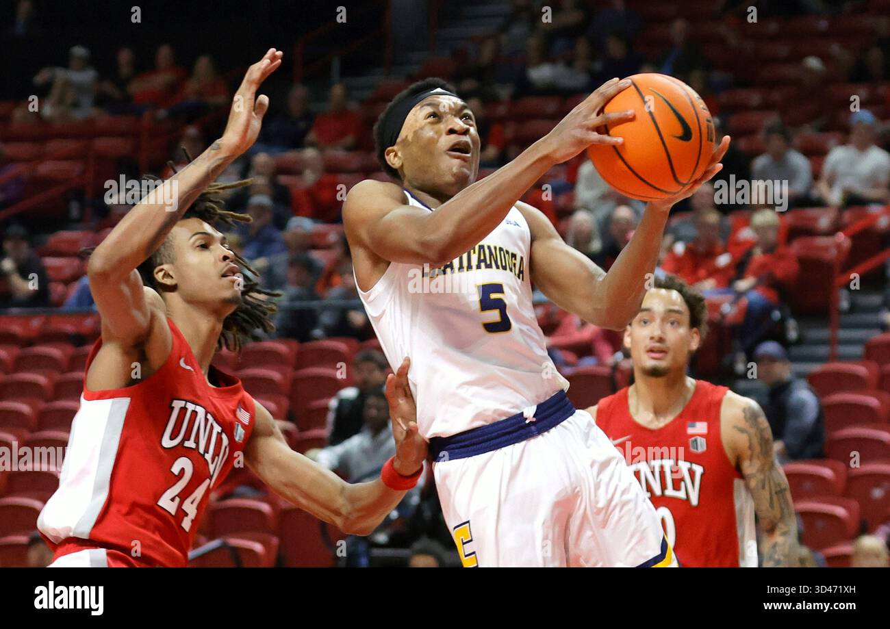 Chattanooga guard Jordan Frison (5) goes to the basket against UNLV ...