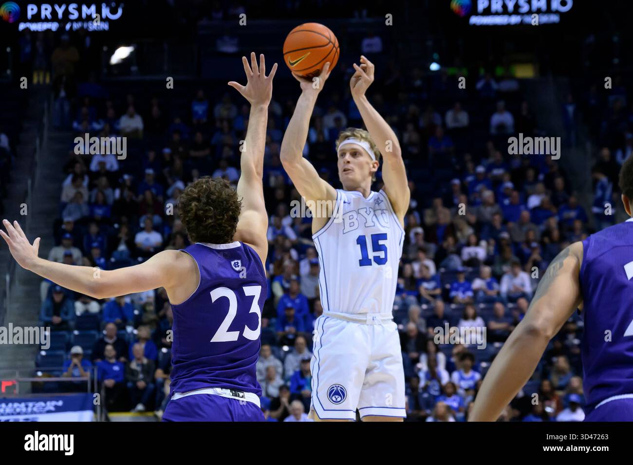 BYU guard Richie Saunders (15) shoots the ball over the defense of Holy ...